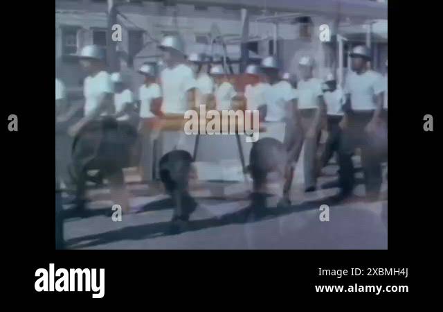 1966 - Recruits do pushups and pull-ups and they train with rifles and ...