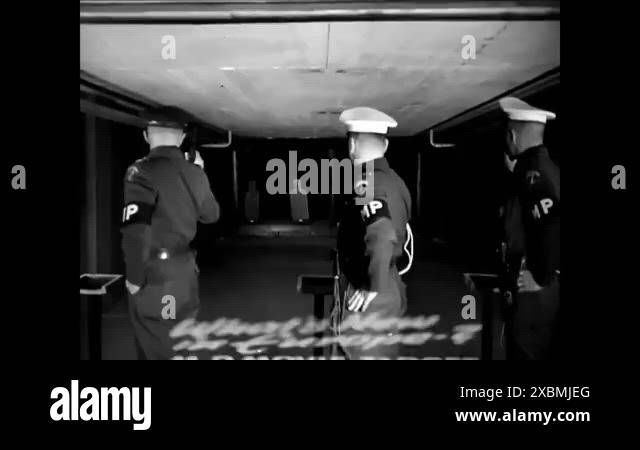 1955 - MP officers use a motion picture target in their shooting range ...