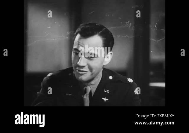 1943 - Photo Intelligence officers use a magnifying glass to spot a ...
