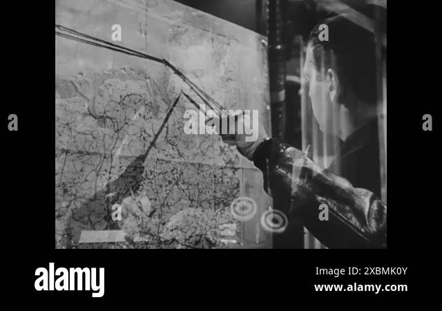 1943 - A map is referred to during a briefing and intelligence officers ...