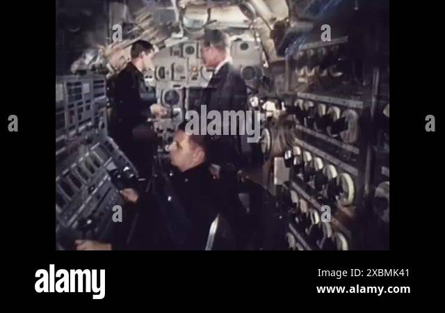 1967 - Actor Chris Bohn speaks as sailors man a United States Navy ...