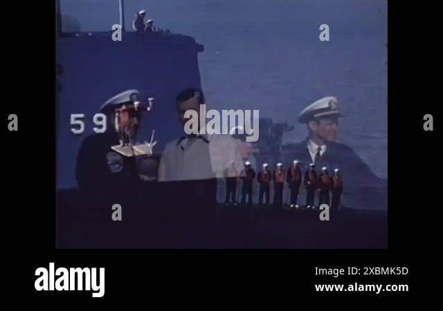 1967 - Actor Chris Bohn stands with United States Navy officers on a ...