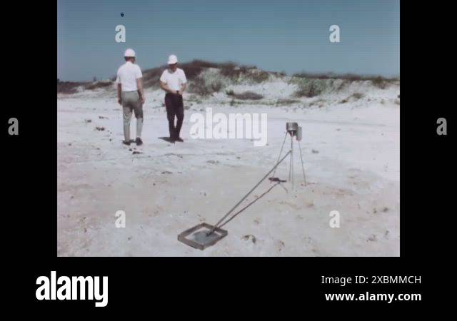 1966 - A two men in SCAPE suits demonstrate a hypergolic reaction ...