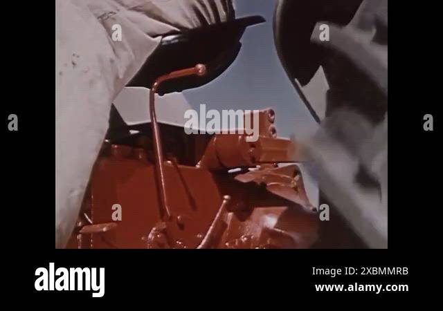 1953 - A farmer works acreage and demonstrates how to use a PTO clutch ...