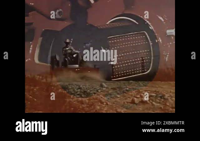 1953 - A farmer works dusty acreage with a Ford Golden Jubilee tractor ...