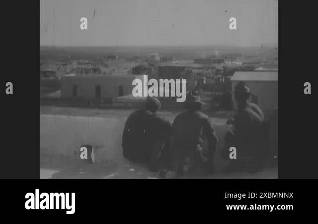1916 - Juarez Jail is shown and construction workers work on buildings ...