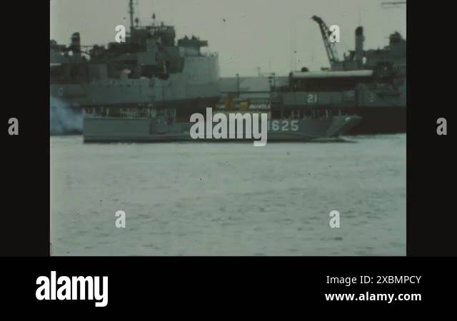1969 - Shots of military ships on the bay, a Thanksgiving program, and ...