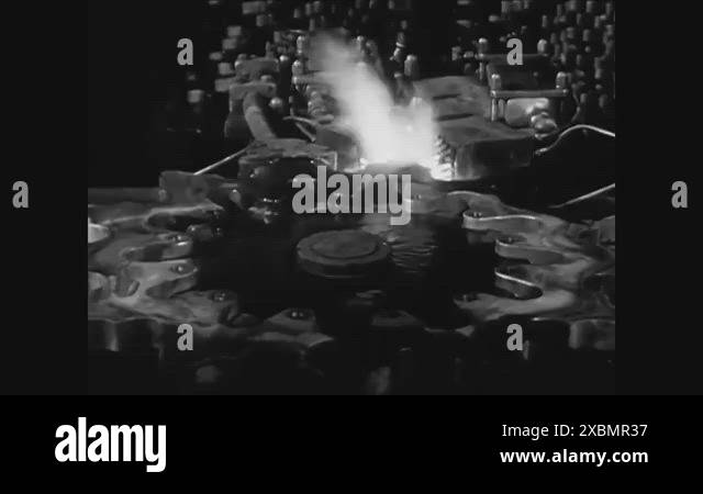 1941 - A tank master wheel is oil quenched at the Detroit Tank Arsenal ...