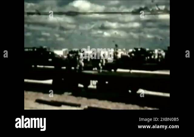 1942 - Heavy army vehicles and equipment are loaded onto trains to be ...