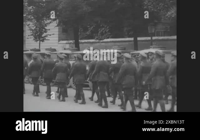 1917, 1918 - Red Cross ambulances drive through an army camp, a village ...
