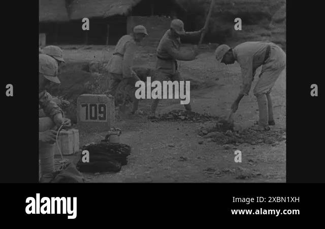 1937 - Chinese soldiers blow up roads and factories and scorch fields ...