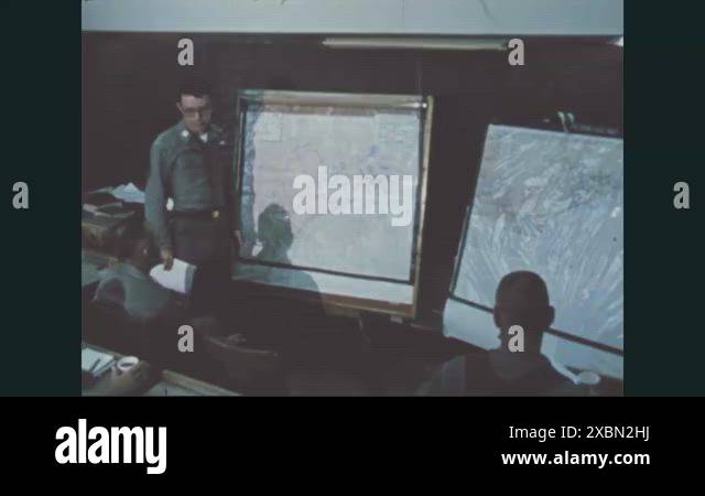 1967 - An army officer points out a section on a map during the Detroit ...