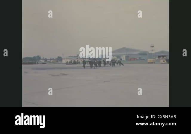 1967— Air Force personnel walk towards military aircraft for boarding ...