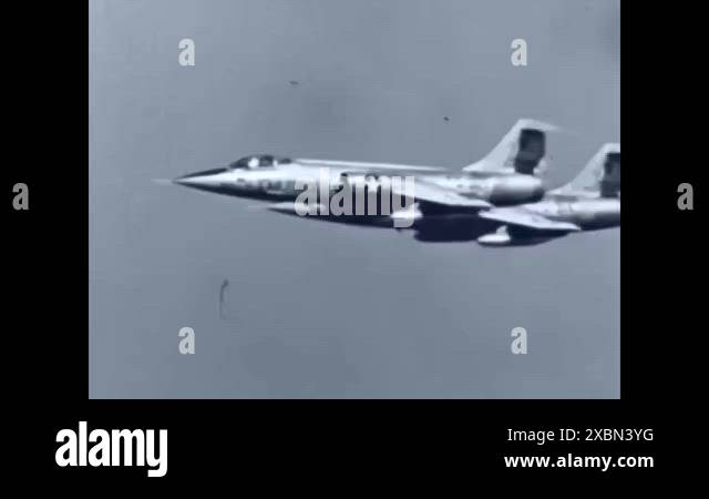 1963 - F-104s fire napalm bombs at armored tanks as part of tactical ...