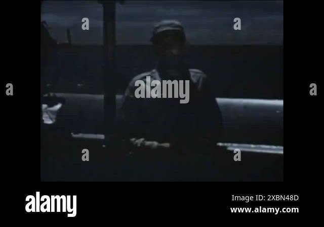 1952 - An officer talks about the upcoming Mike Shot on the deck of the ...