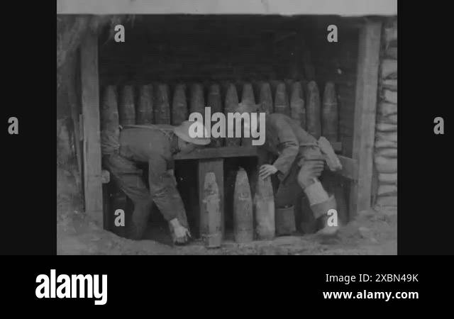 1918 - Soldiers stacking artillery shells, infantry officers at Mont ...