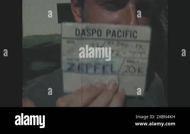 1972 - A man picks a coconut from a tree, and people play tennis and ...