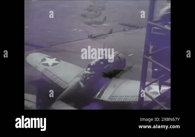 1971 - WWII military planes fly and fire at enemy watercraft during ...