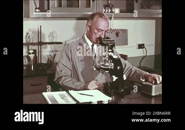 1960s - An FBI examiner looks at soil samples under a petrographic ...