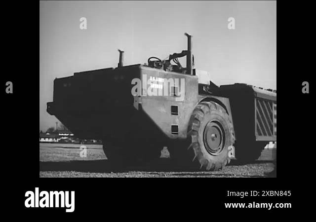 1956 - Two types of the US Army goer tank are shown driving down a road ...