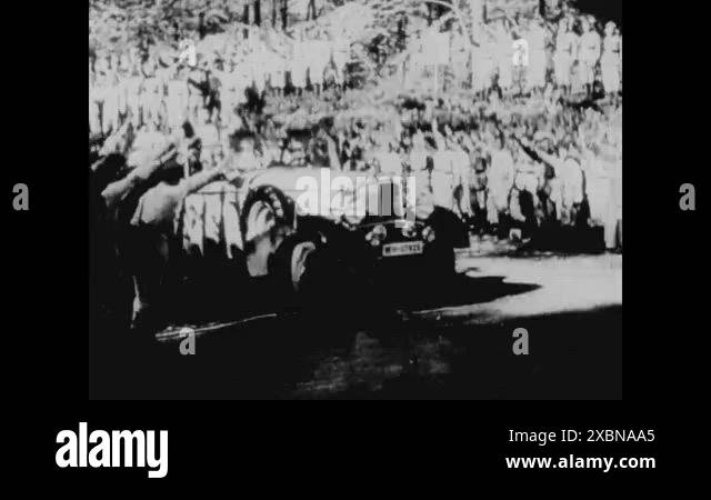 1943 - Adolf Hitler is driven in a military parade and warplanes and ...