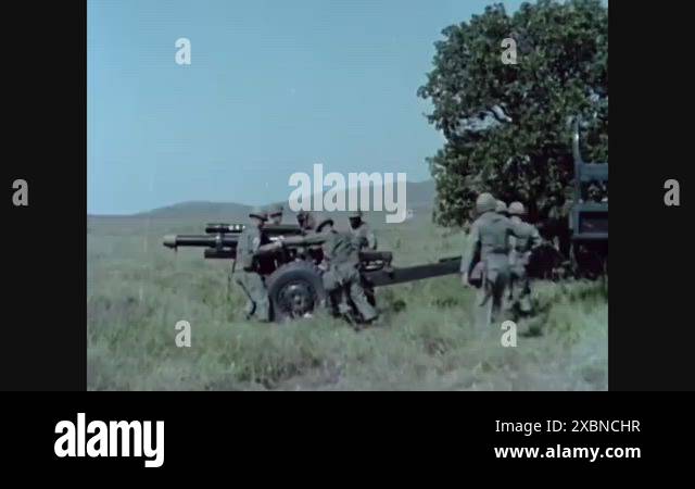 The 105mm Howitzer artillery weapon is towed to a battle site and ...