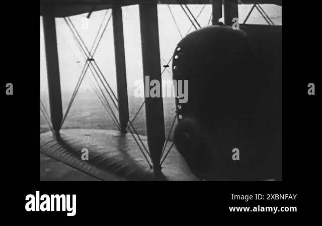 A pilot and the passengers aboard a Handley Page Type O aircraft see the English countryside ...