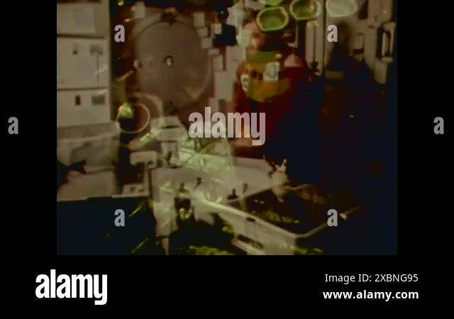 Astronauts inside Skylab perform tasks and somersault in the zero ...