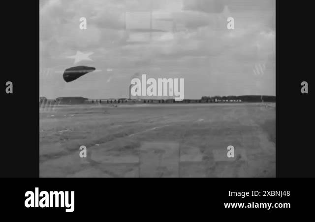 Parachute riggers practice rigging heavy equipment in the 1960s Stock ...