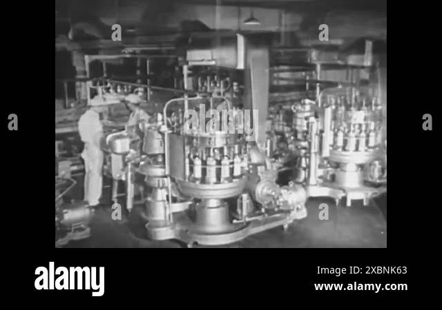 Milk is packaged in cartons on an assembly line and flake ice is ...