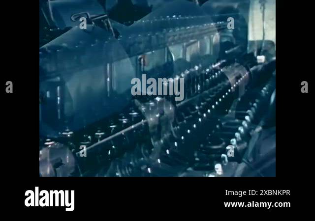 Machines make uniform yarn in a textile factory in the 1940s Stock ...