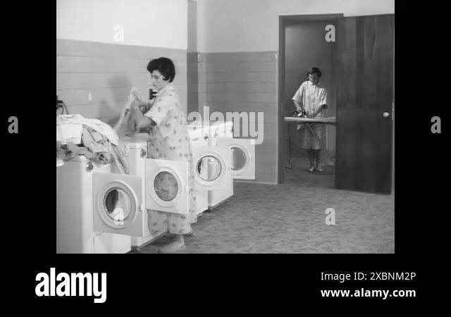 Women use washing machines to do their laundry at the Women's Army ...