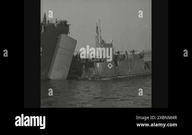 Equipment, vehicles and heavy machinery are ferried to shore, as well ...