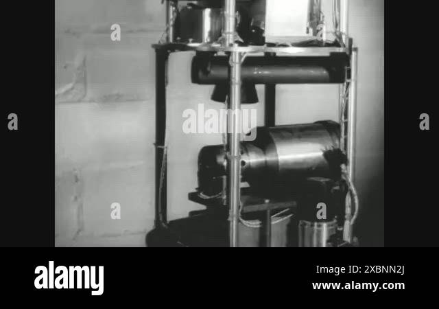 1952 - An oxygen bottle and carbon dioxide absorber are installed in ...