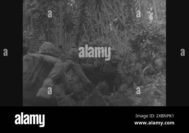 1943 - Troops shoot an Imperial Japanese Army sniper and move forward ...