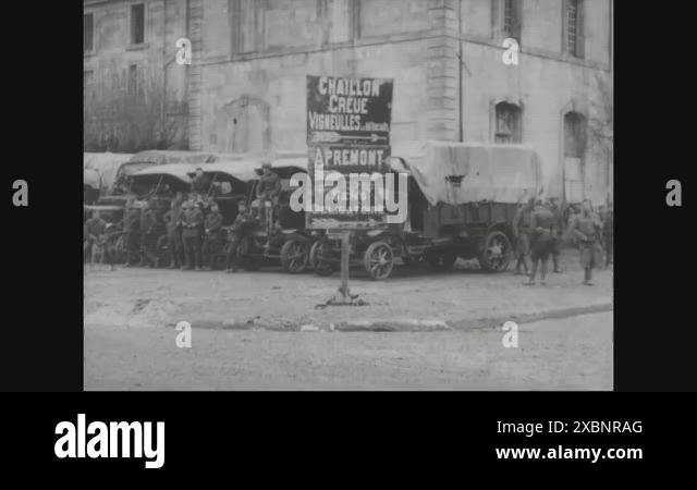1918 - Medics bandage a broken leg and a head wound and prepare a ...