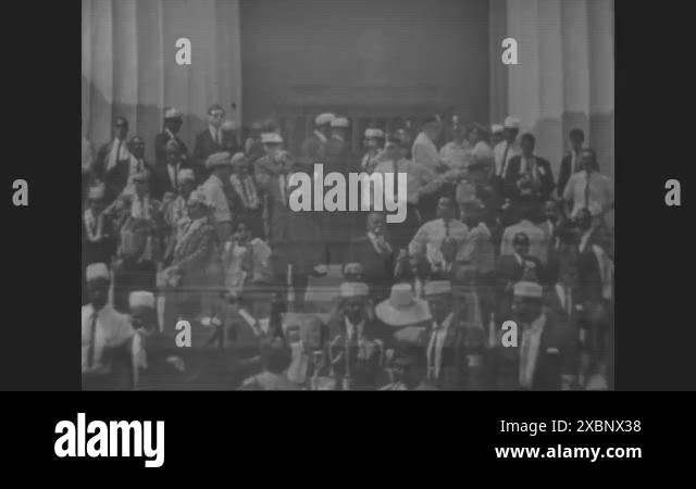 1963 - Performers and crowds sing and clap on the steps of the Lincoln ...