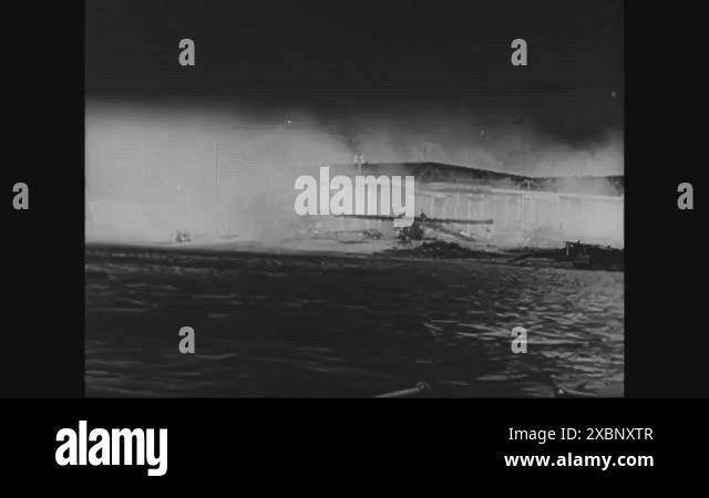 1941 - Burning, wrecked warships are shown in the aftermath of the ...