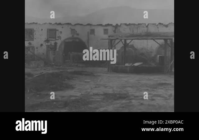 1918 - Footage is shown of a bombed out town in France. Soldiers work ...