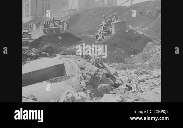 1944 - Bulldozers and troops traveling in trucks with artillery and ...