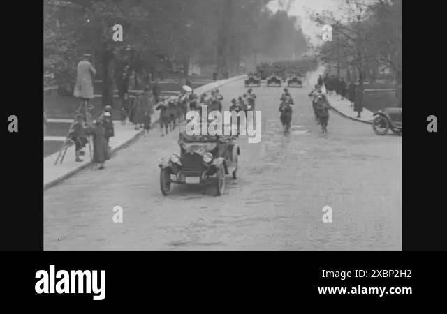 1918 - A marching band and fleet of automobiles, and an aerial view of ...