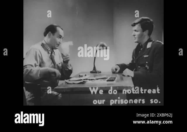 An Air Interrogation Officer smokes cigarettes with a Nazi prisoner of ...