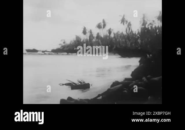 Troops invade an island, finding wreckage and corpses, and capture ...