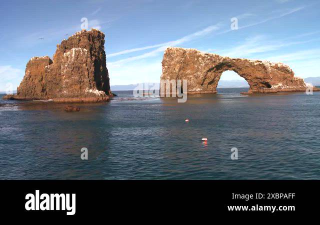 Anacapa Island's iconic natural bridge and nearby islets in Channel ...