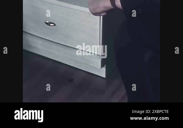 A policeman demonstrates how to properly bag and seal physical evidence ...