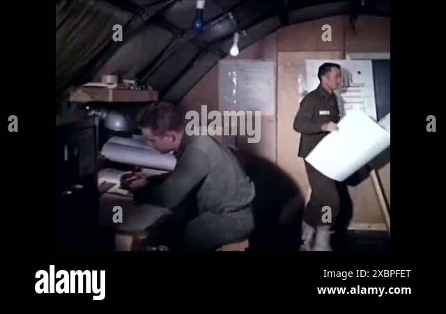 1963 –A group of military construction workers meet and discuss ...