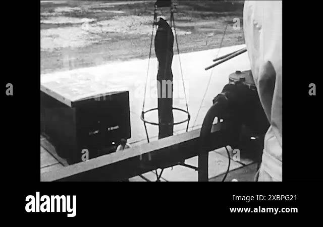 The Explorer 1 satellite is hoisted onto the Jupiter-C rocket, at Cape ...