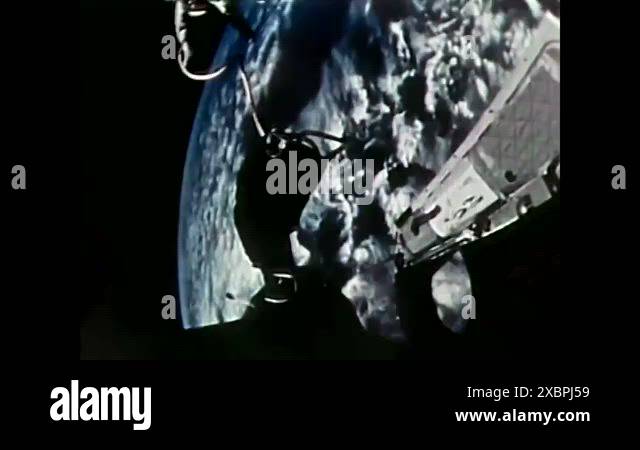 Spaceman Edward White takes a walk in space (an EVA: extra vehicular ...