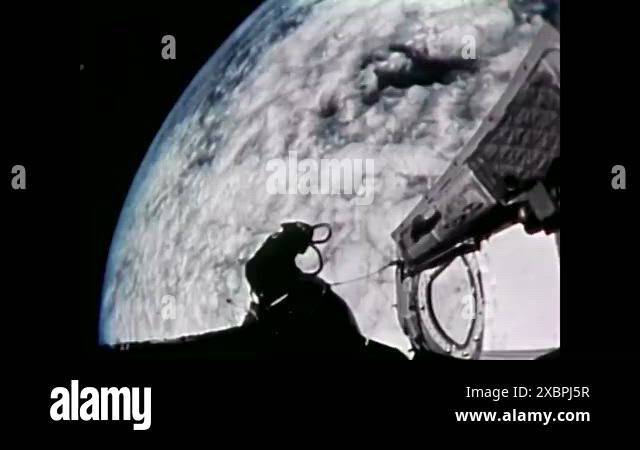 Spaceman Edward White takes a walk in space (an EVA: extra vehicular ...