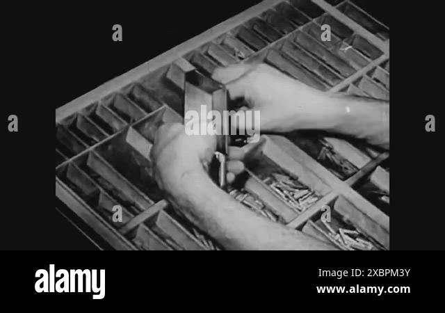 A student correctly slides type into place in a case in the 1950s Stock ...